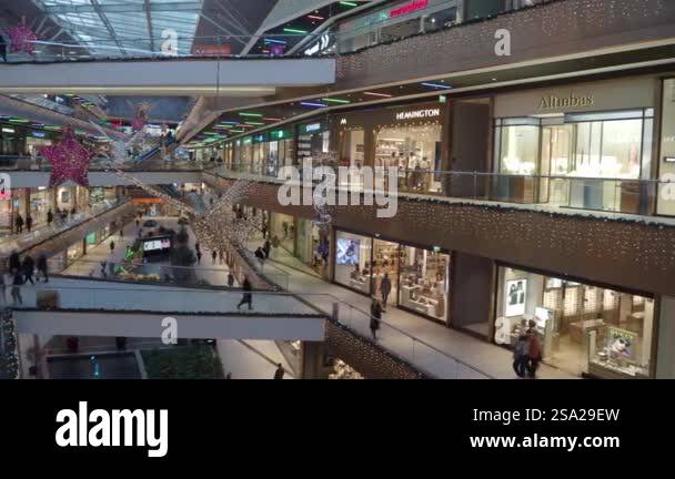 An incredibly busy shopping mall that showcases a vibrant and dynamic ...