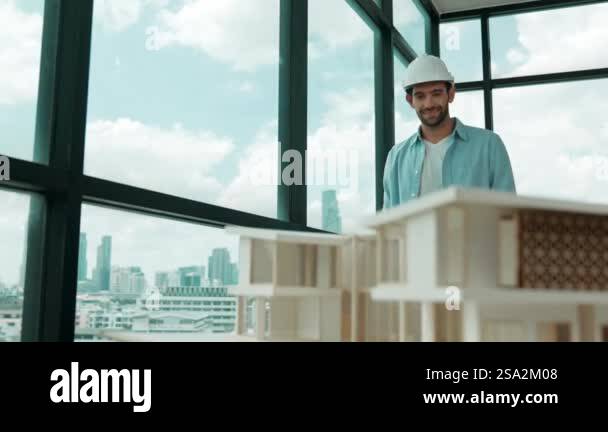 Professional architect engineer walking while looking at skyscraper ...