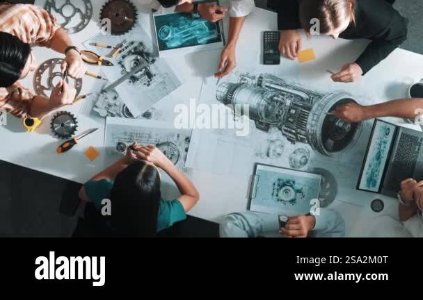 Top down aerial view of smart engineer team working together to design ...