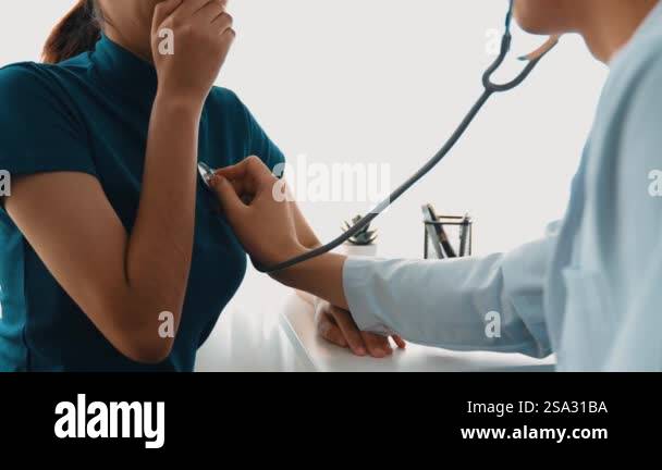 Patient attend doctors appointment at clinic or hospital office. Doctor examining and diagnosis ...