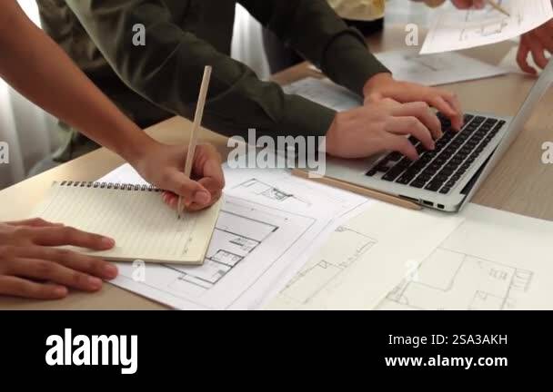 Architect and engineer consulting construction detail blueprint display ...