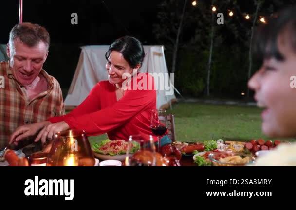 Family together for holiday celebration in garden. Family member gather ...