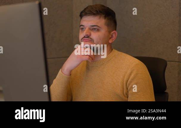 Focused Man Thinking While Working on Computer in Modern Office. High ...