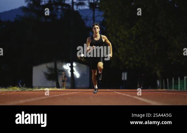 Strong Male Athlete is Running Towards an Obstacle, Hurdling, Jumping ...