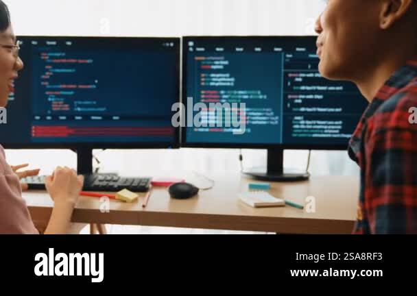 Slow motion back end software developer engineer for computer programming working together on ...