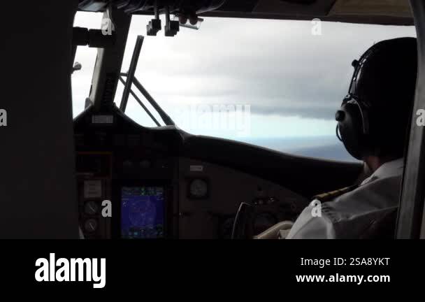 The pilots are sitting at the controls of the seaplane. The view from ...