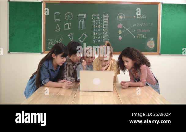 Top view diverse student looking at laptop and learning about coding engineering code and ...