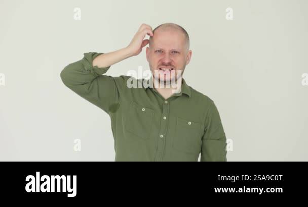 Man showing confusion thinking about difficult question and scratching ...