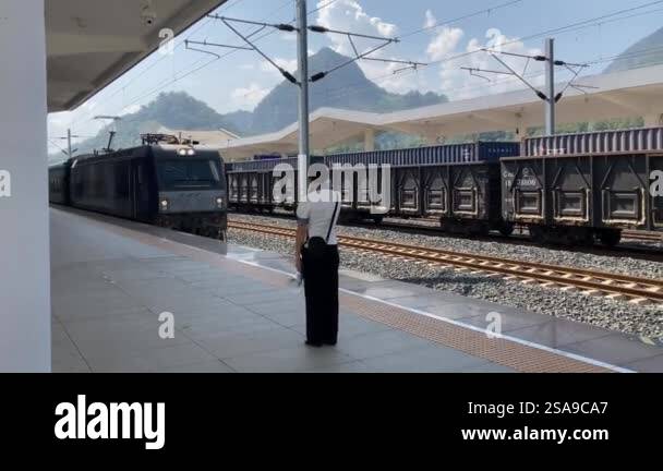 The Laos speed train arrives at the station, with passengers eagerly ...