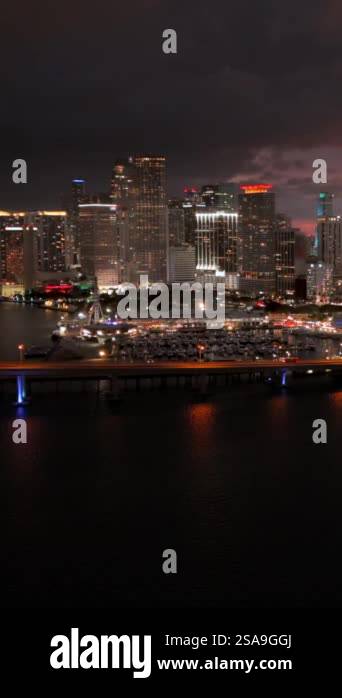 Aerial footage highlights Miami vibrant skyline at night, illuminating ...