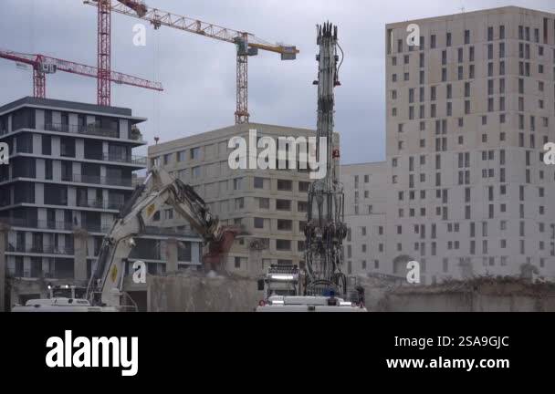France, Bordeaux 01.20.2025, Building demolition excavator with ...