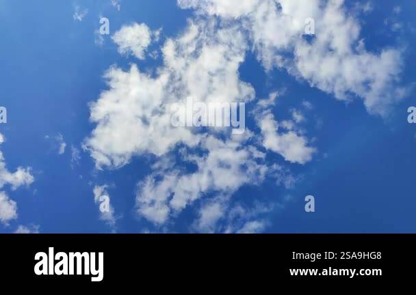 Fast moving white cloud in blue sky on a sunny day. Fast moving and ...