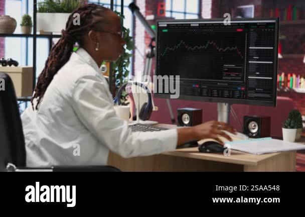 Frustrated day trader feeling upset, looking at PC screens showing ...