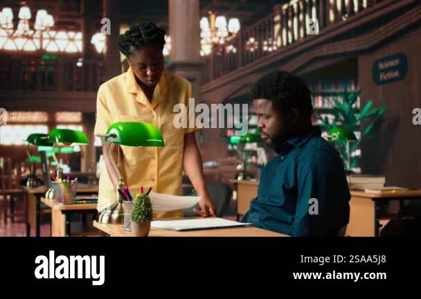 Black dedicated scholar works on their thesis project in the quiet ...
