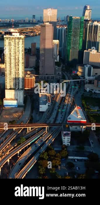 High-rise buildings in the bright rays of sun at sunset. Magnificent ...