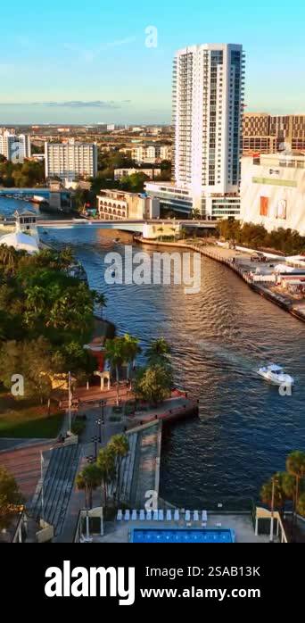 Motor boats are on the narrow river in the city downtown. Beautiful ...