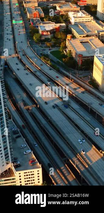 Lively multi-lane speedway with cars running by. Highway in downtown of ...