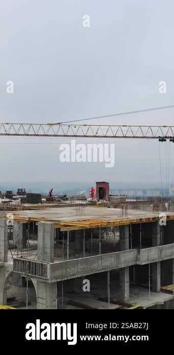 Process of construction high-rise building. Labor workers on a big ...