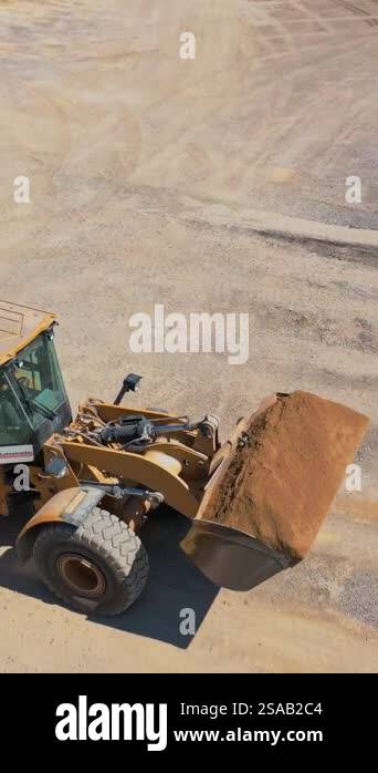 Excavator on the territory of asphalt manufacture outdoors. Modern ...