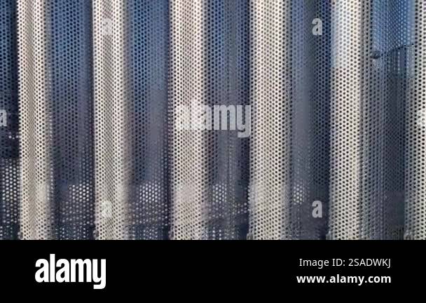 building is lined with square panels. metal sheet wall cladding with ...