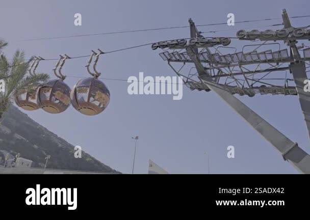 Haifa, Israel, January 02, 2025 : The cable car cabins arrive at the ...