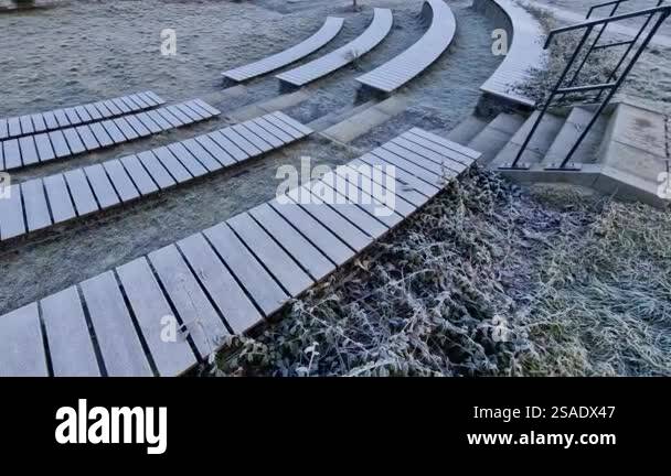 stone bench in the arch lined with wooden planks. outdoor theater ...