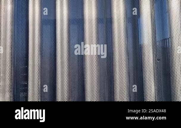 building is lined with square panels. metal sheet wall cladding with ...
