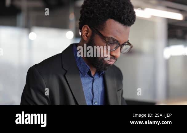 Frustrated young businessman takes off glasses and rubs face from ...
