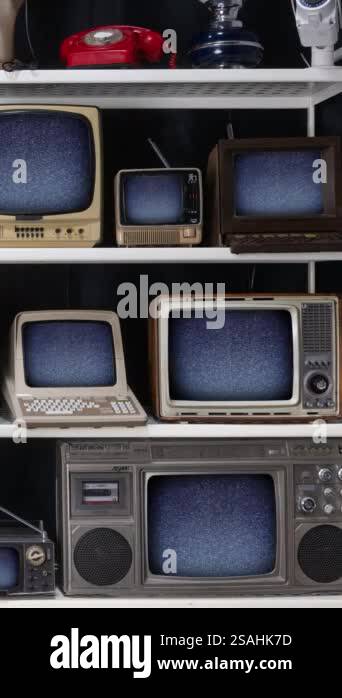 Collection of vintage and retro televisions on shelves moving in stop ...
