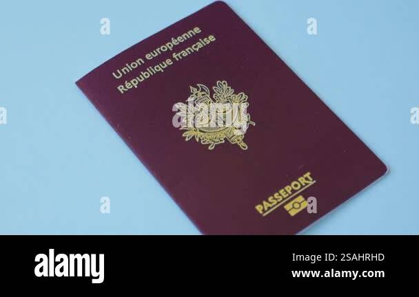International passport of a citizen of France on a dark concrete ...