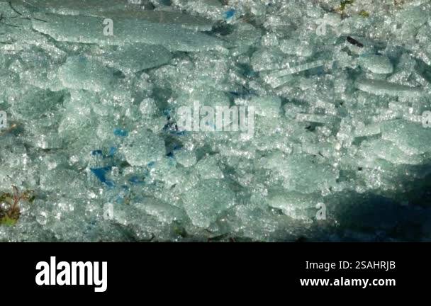 Fragments of a broken glass panel, smashed window scattered on the ...