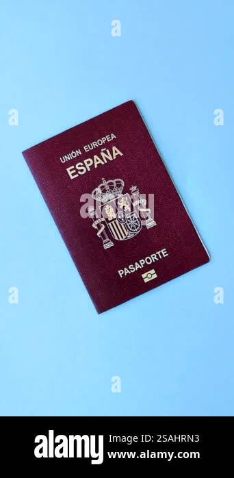 International passport of a citizen of Spain on a dark concrete ...