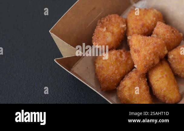 Brie cheese or camembert fries in breading, fast food, takeaway on a ...