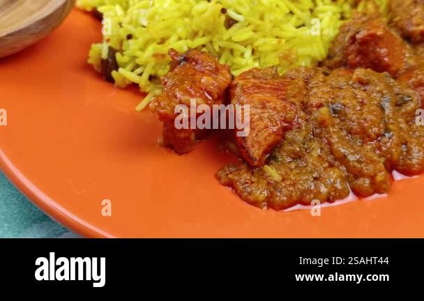 chicken biryani and raisin rice Stock Video Footage - Alamy
