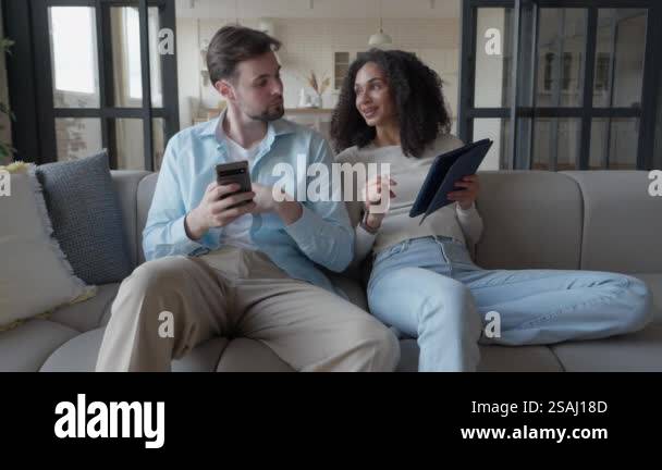 Young Couple Persons are Chilling at Home and Surfing Web on Phones and ...