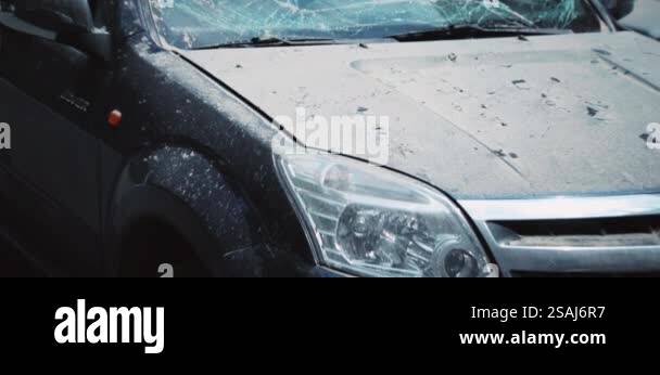 Footage of beautiful vehicle with broken windshield and glass fragments ...