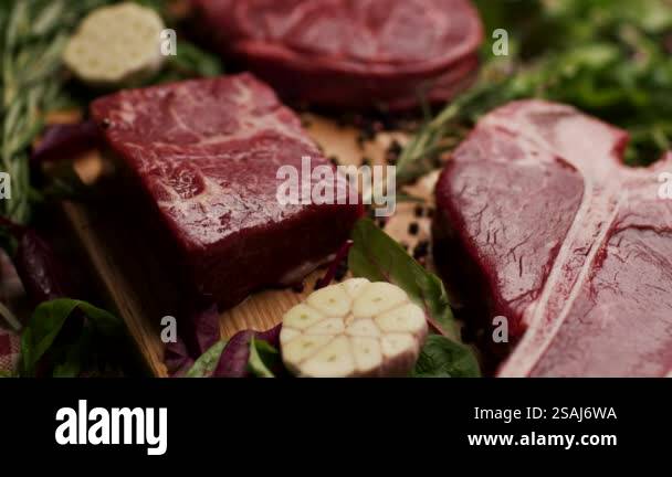 Different types of raw beef steaks, including T-bone and Osso Buco cuts ...