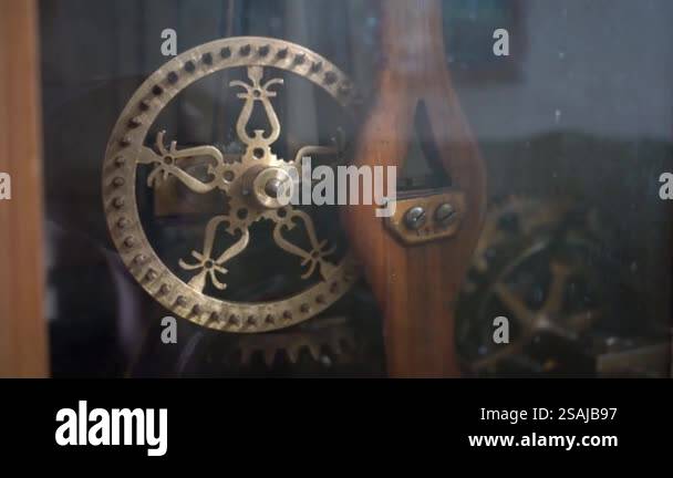 Old pendulum mechanism in the town hall clock. Tower inside. Clockwork ...