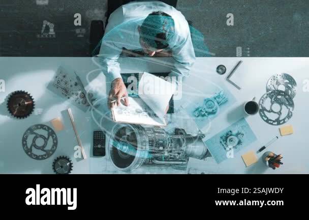 Top down view of architect engineer writing and planning turbine engine ...