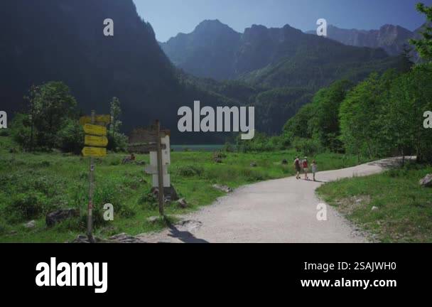 June 15, 2023. Germany, Salet, Schoenau am Koenigsee. Tourists follow ...