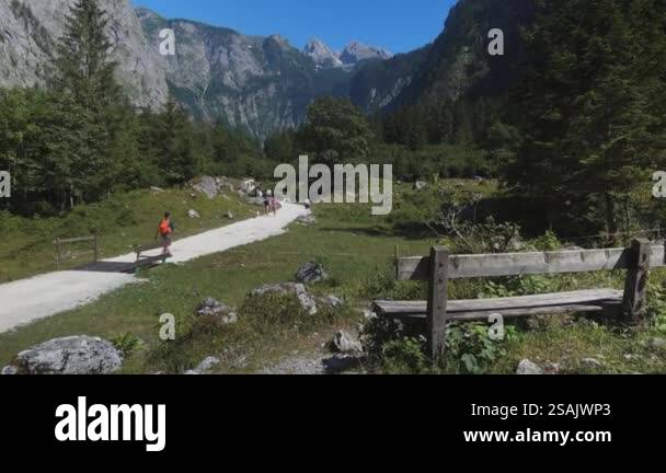 June 15, 2023. Germany, Salet, Schoenau am Koenigsee. Tourists follow ...