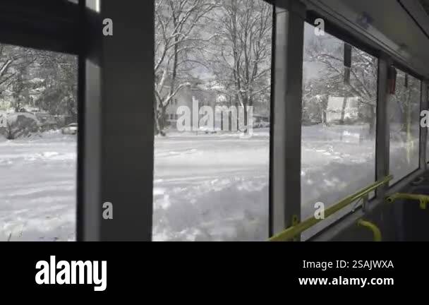 View through bus window in Munich, Germany of snowy streets, snow ...