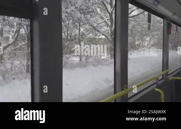 View through bus window in snowy Munich, Germany, reveals streets ...