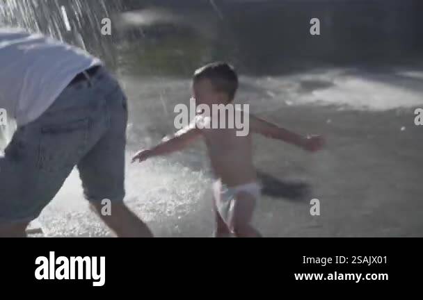 Ukraine, Odessa, August 25, 2021. Happy children playing and bathing in ...