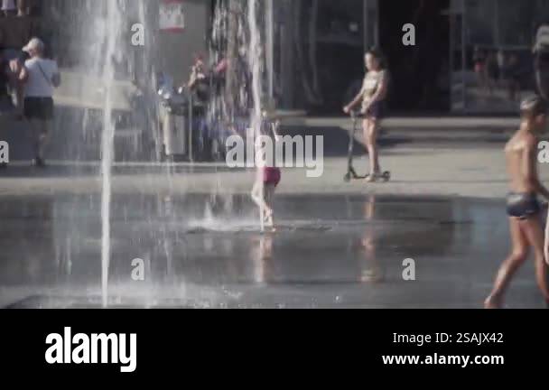 Ukraine, Odessa, August 25, 2021. Happy children playing and bathing in ...