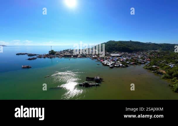 High-up aerial view of Placer fishing port and town in Surigao Del ...