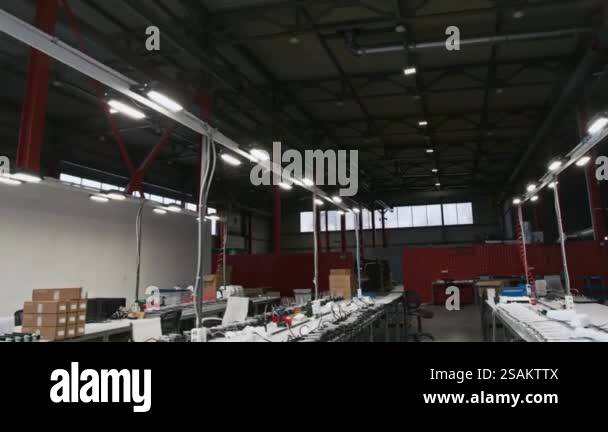 Full dolly no people shot of semi-finished LED lamp components on ...