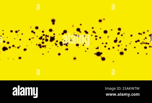 Black particles float on an intense yellow background. 4k loop ...