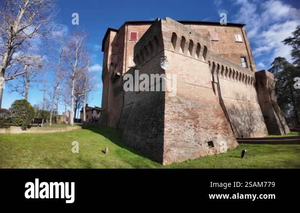 Medieval fortress of Dozza castle rising majestically on a green hill ...