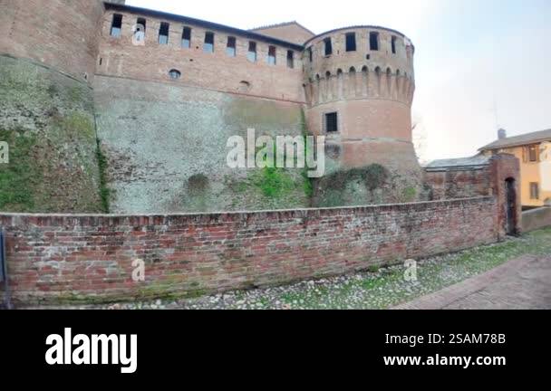 Moss covering the medieval walls of Dozza Castle, a historic fortress ...